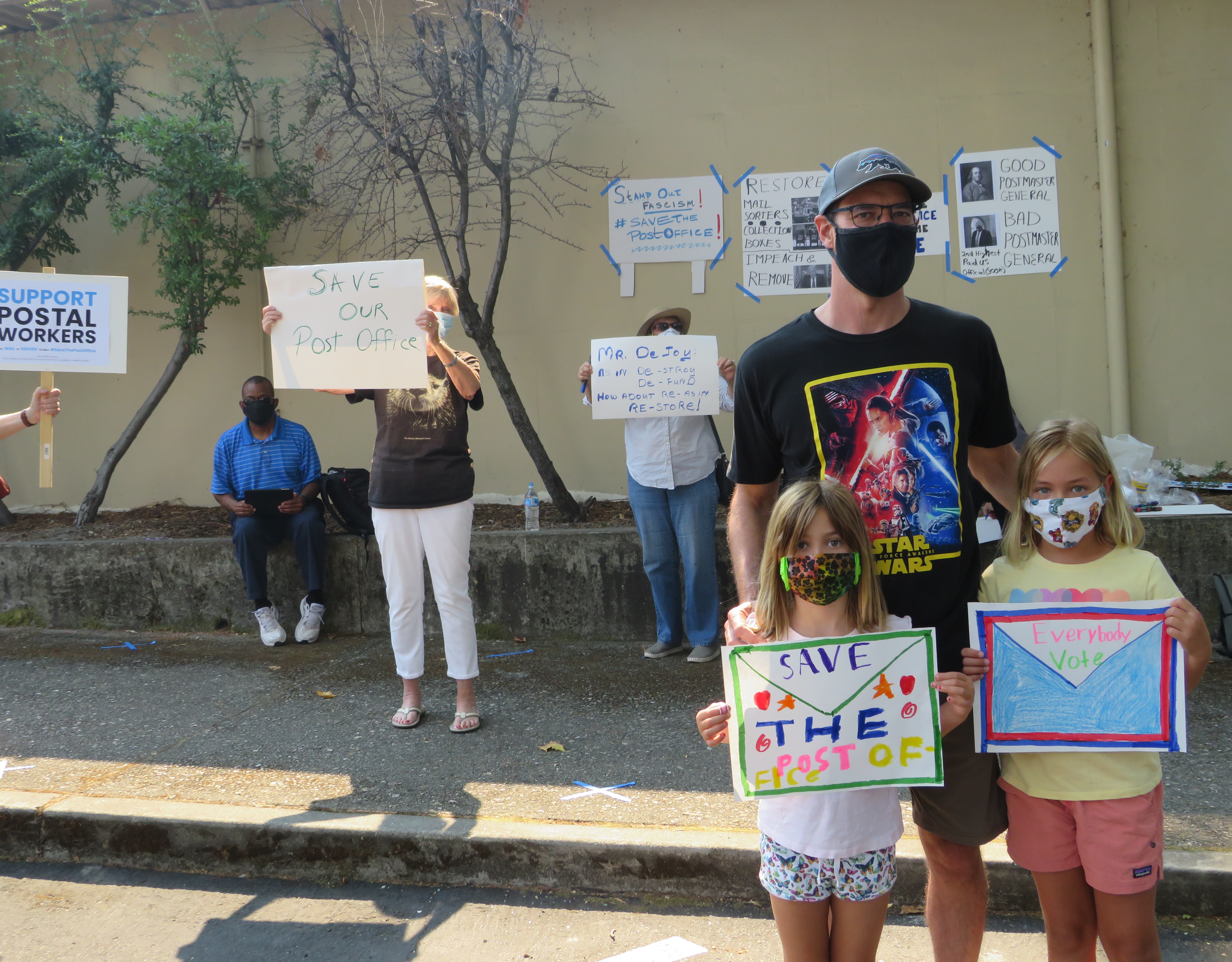 USPS Chad Curran, with dtrs Madeline (L), Sofia | The Orinda News